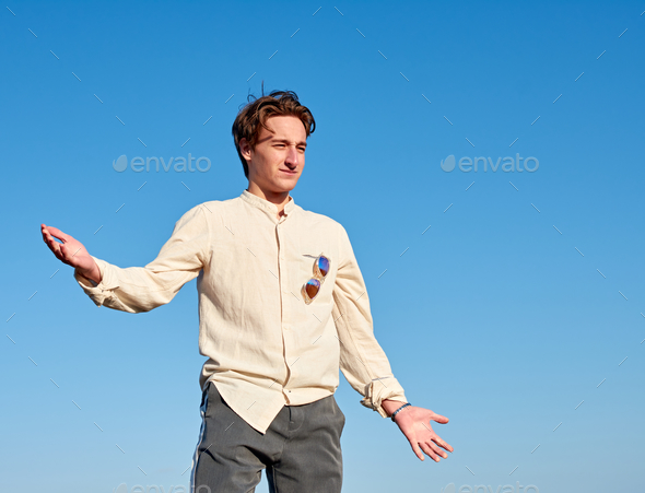 Caucasian man from Spain acting confused and surprised on clear sky ...