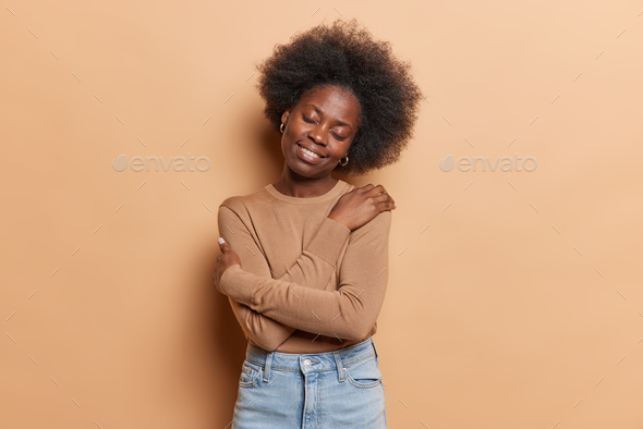 Curly Haired Woman Recalls Romantic Event Embraces Herself With Both