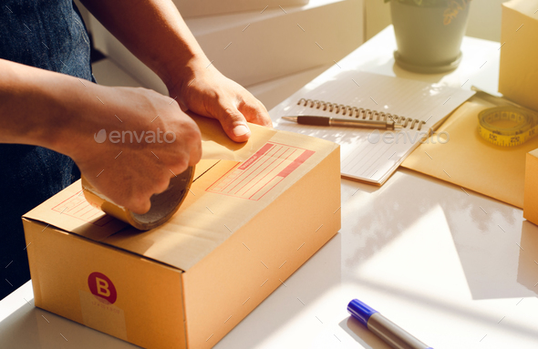 Employees are preparing products to be packed into boxes. for delivery ...