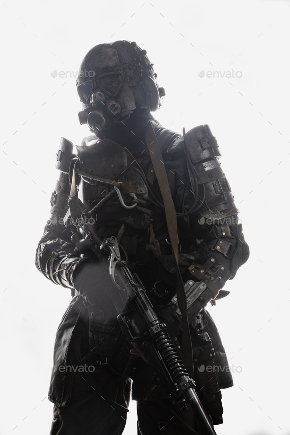 Military soldier in spirit of post apocalypse against backlit Stock ...