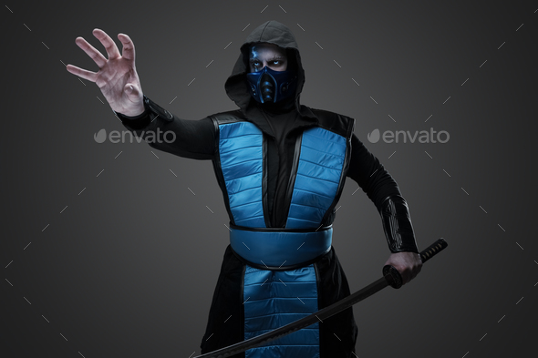 Ice fighter with hood and katana in fight stance Stock Photo by fxquadro