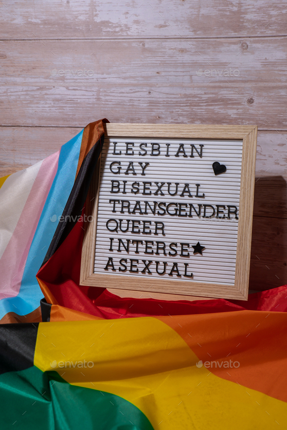 LGBTQIA description frame on Rainbow LGBTQIA flag made from silk ...