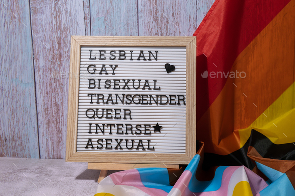 LGBTQIA description frame on Rainbow LGBTQIA flag made from silk ...