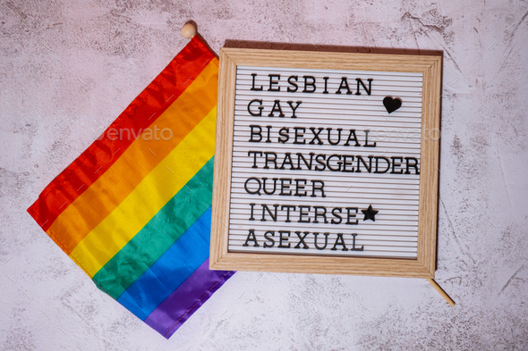 LGBTQIA description frame on Rainbow LGBTQIA flag made from silk ...