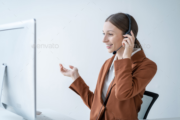 Customer service executive working at the office. Stock Photo by thichas