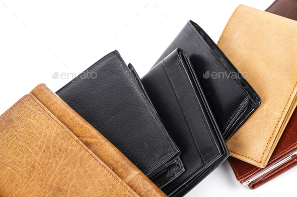 Stack of different wallets on white background Stock Photo by BLACKDAY