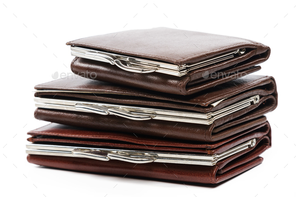 Stack of different wallets on white background Stock Photo by BLACKDAY