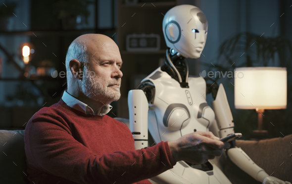 Senior man and android robot watching TV together Stock Photo by stockasso