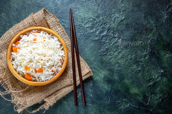 top view delicious boiled rice inside little plate on dark background ...