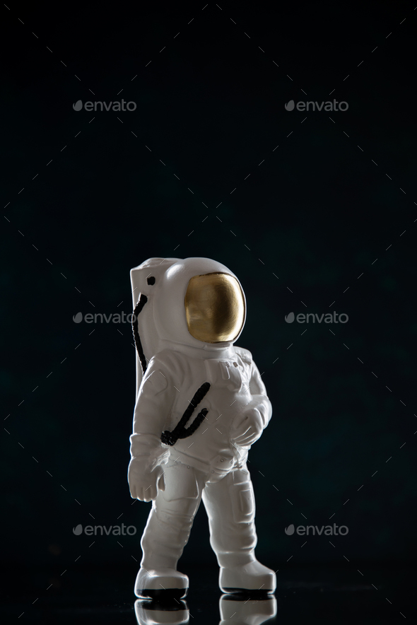 front view of spaceman toy on black desk death funeral war palestine ...