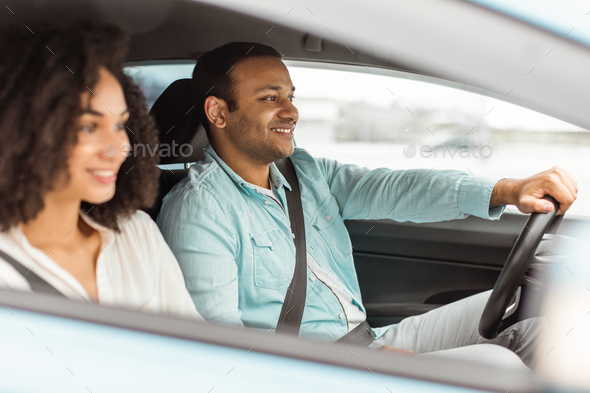 Cheerful Middle Eastern Couple Enjoying Ride In Car, Side View Stock ...