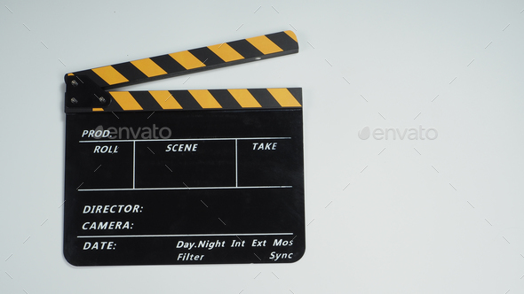 Movie slate or clapper board in yellow and black color on white ...