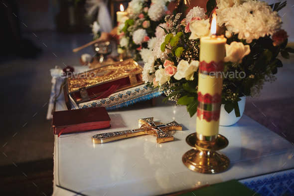 Church utensil, wedding crowns on an altar, cross and the Bible on ...