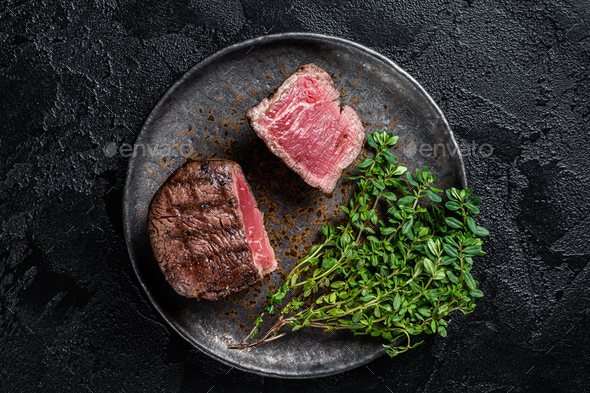Prime Fillet Mignon Steaks, grilled beef tenderloin meat. Black ...