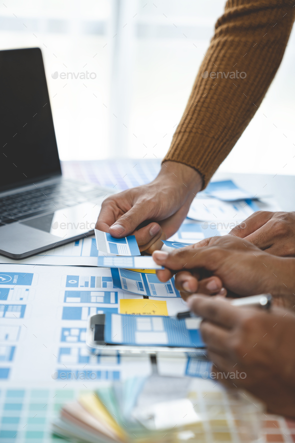 A group of Asian UI developers, designers, and data researchers are ...