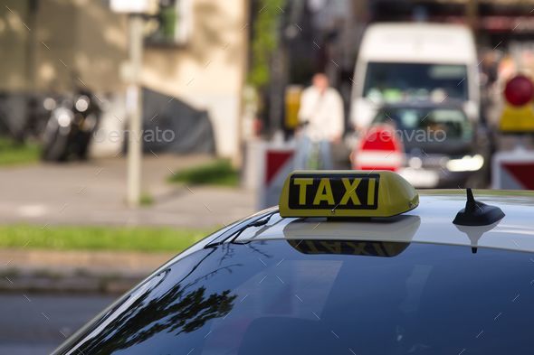 Closeup of a signage of "taxi" on top of a car outdoors Stock Photo by ...