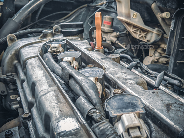 Closeup of the engine and other parts of a modern car under the hood ...