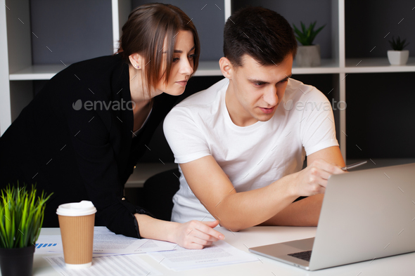 Loving couple working successfully together on their own business Stock ...