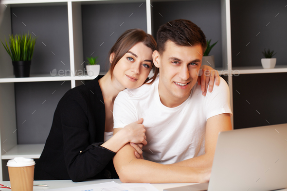 Loving couple working successfully together on their own business Stock ...