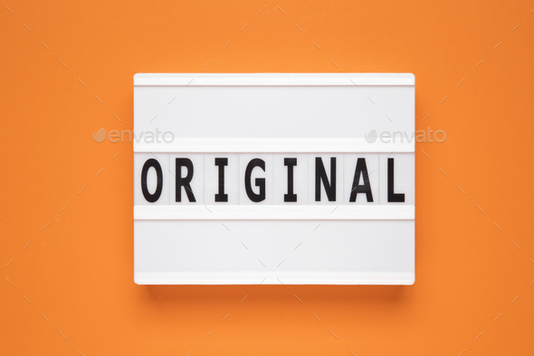 The word original on lightbox isolated orange background. Info concept ...