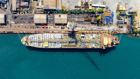 Oil tanker ship at dry dock concept maintenance service. working at dry ...