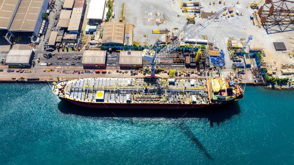 Oil tanker ship at dry dock concept maintenance service. working at dry ...