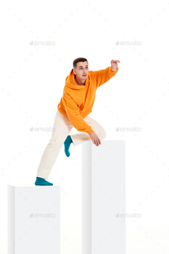 man rising up the career ladder. guy following up on white diagram ...