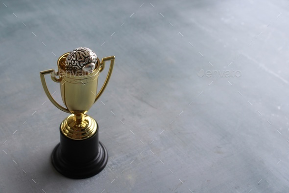 Brain inside gold cup trophy with copy space. Stock Photo by ...
