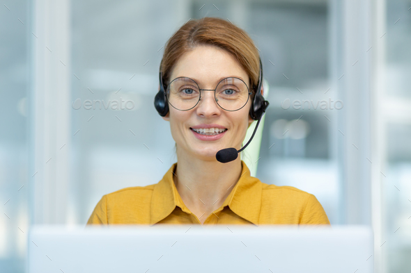 Portrait of mature female customer service worker, mature business ...