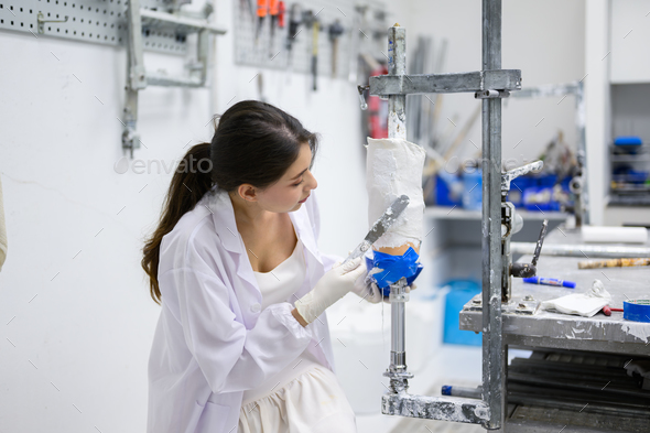 Prosthetic technician sculpting plaster cast for socket at factory Stock Photo by 1footage