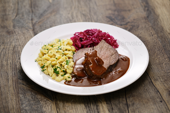 Sauerbraten (a German national dish, marinated braised beef) with ...