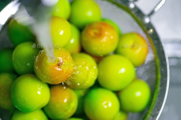 Close up shot of the umeshu Japanese plum wine making process with ...
