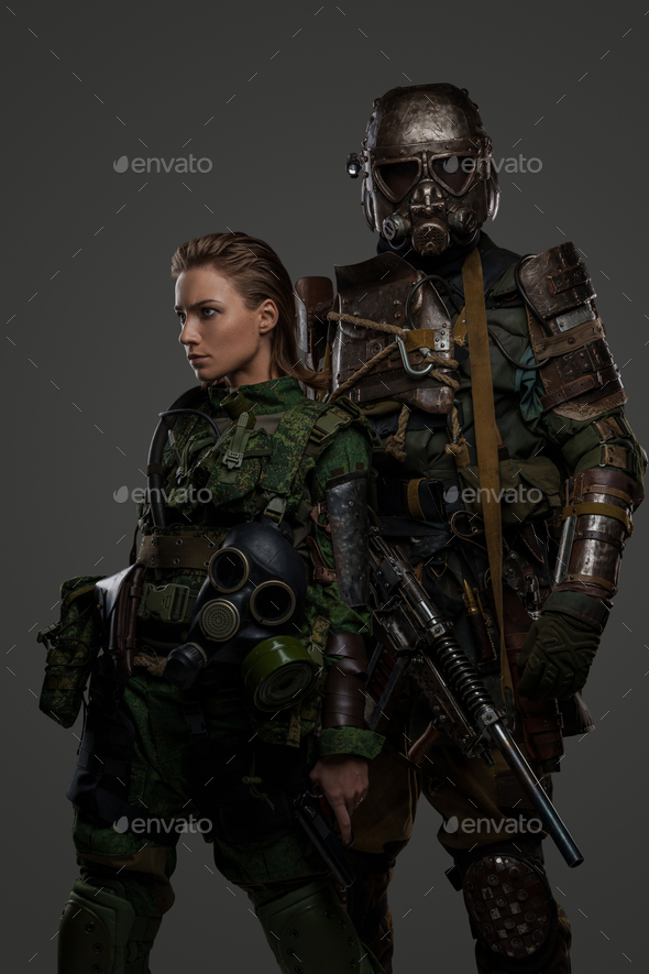 Shot of post apocalyptic couple with pistol and shotgun Stock Photo by ...