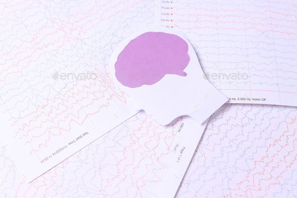 Brain paper cutout on background of brain waves from ...