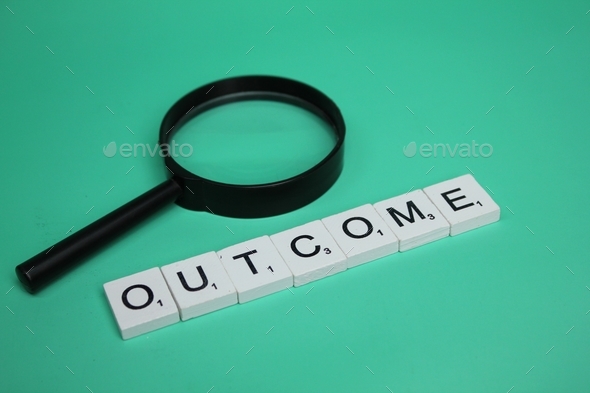 magnifying glass and the word outcome with a blurred green background ...