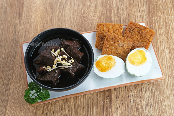 Rawon, Indonesian Traditional beef black soup Stock Photo by tyasindayanti