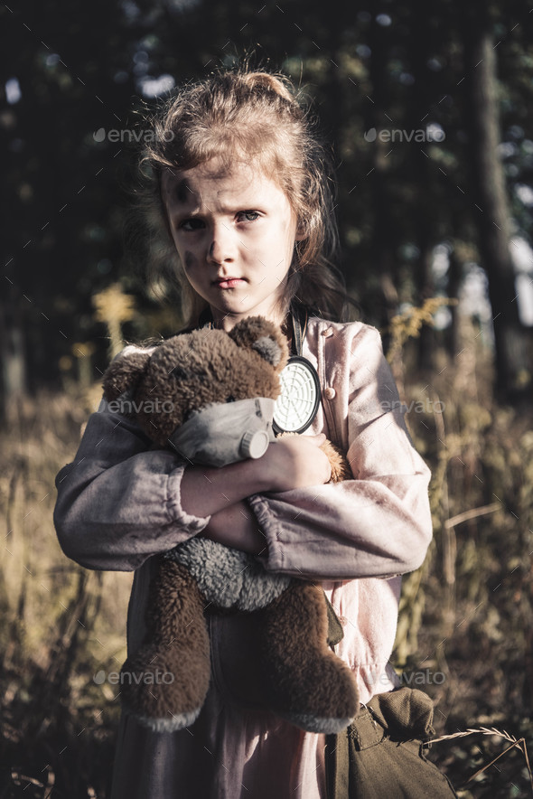 sad child holding dirty teddy bear in chernobyl, post apocalyptic concept Stock Photo by ...