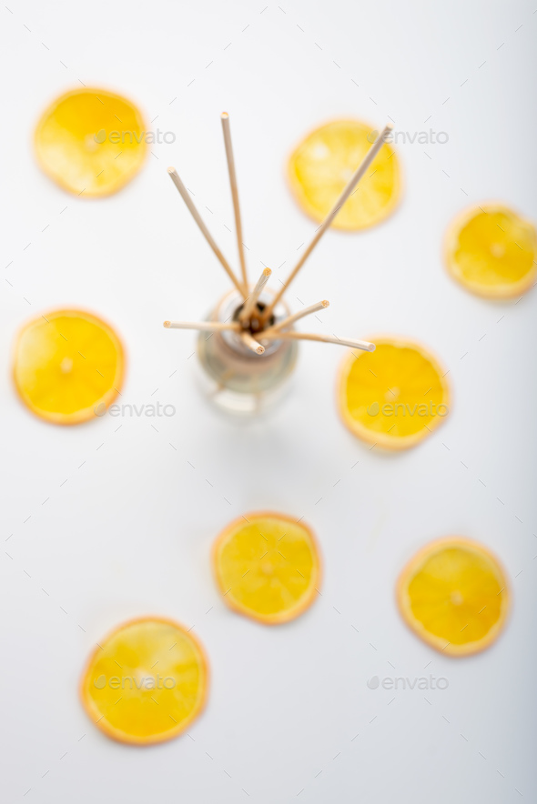Citrus reed diffuser home on white background Stock Photo by stenvlad