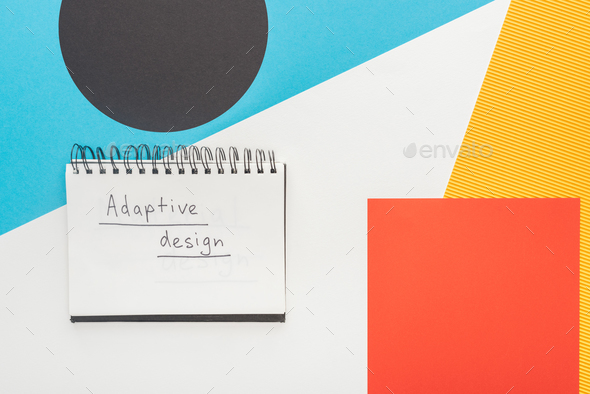 top view of notebook with adaptive design lettering on abstract ...