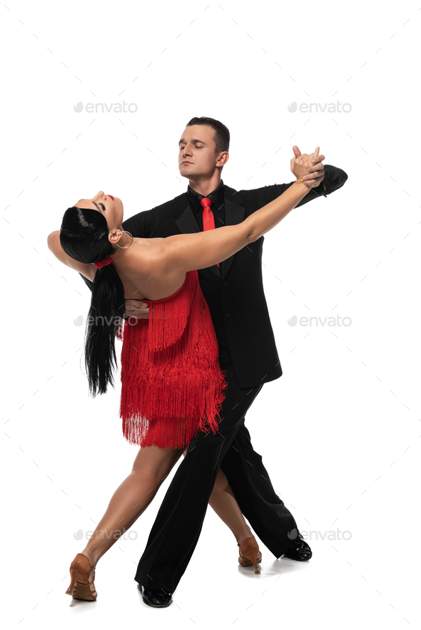 Handsome Elegant Dancer Leading Attractive Partner While Performing Tango On White Background