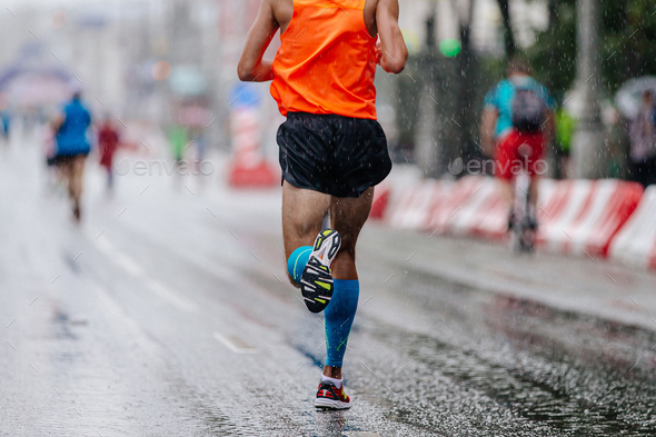 rear view runner athlete run marathon race on rain Stock Photo by ...