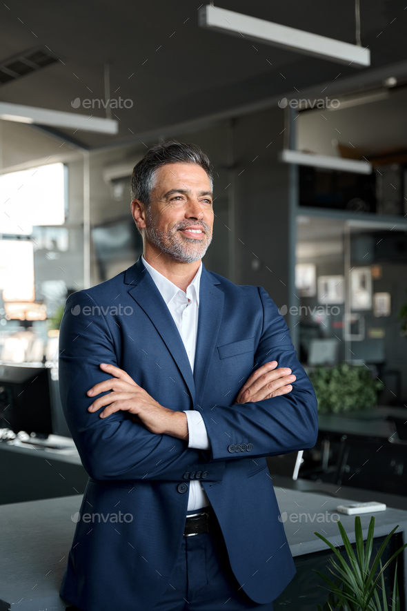Happy proud mature business man ceo standing in office arms crossed ...