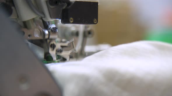 Closeup of Overlock Foot and Cutter Overlocking Cuff in Glove ...