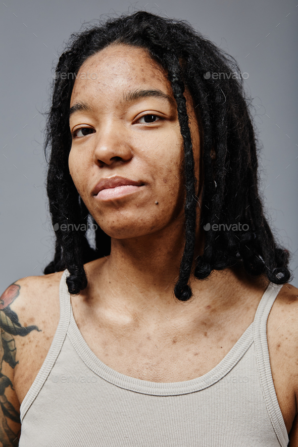 Black young woman with no makeup and real skin texture Stock Photo by ...