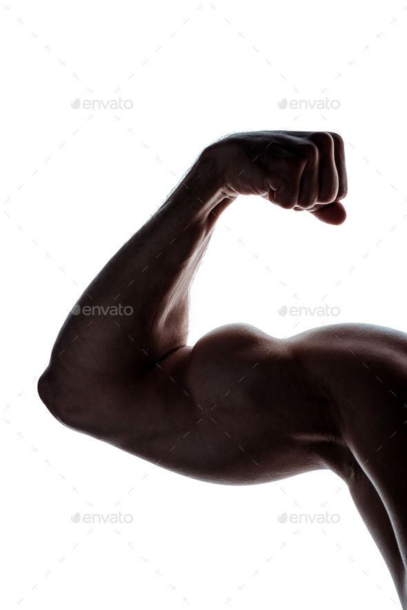 cropped view of muscular bodybuilder showing biceps in shadow isolated ...