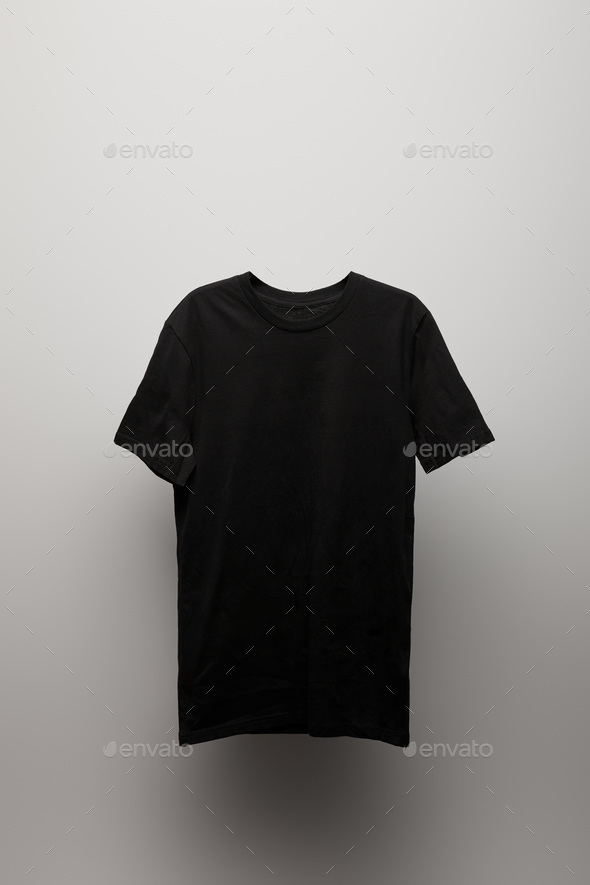 blank basic black t-shirt on grey background Stock Photo by ...