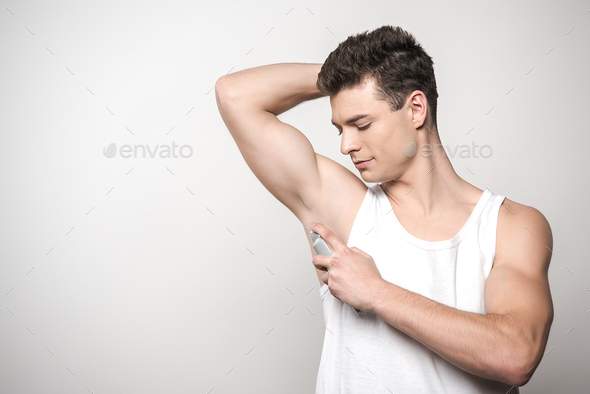 Boy Putting On Deodorant