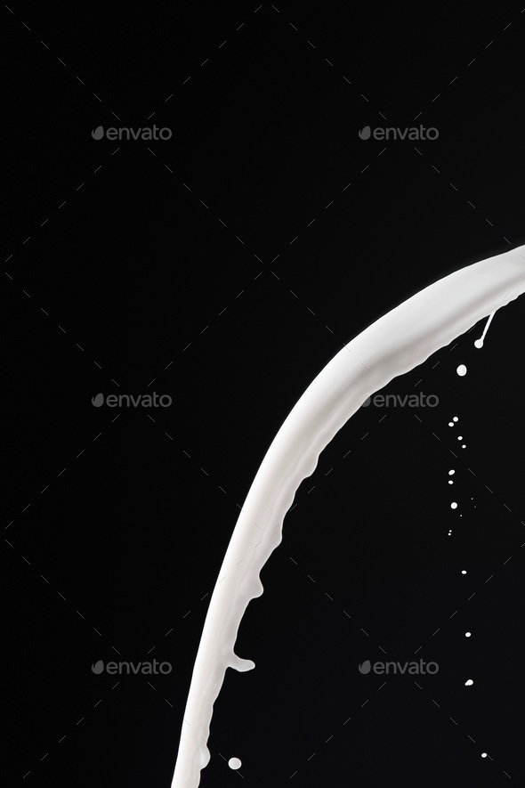 fresh white milk splash isolated on black Stock Photo by LightFieldStudios