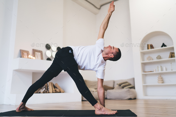 Man doing Triangle pose with Gyan mudra Stock Photo by GaudiLab | PhotoDune