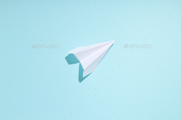 Business, startup and sponsorship concept with paper plane on blue ...